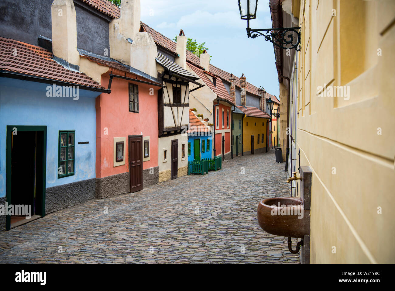 Cobblestone street and colorful 16th century cottages of artisans known ...