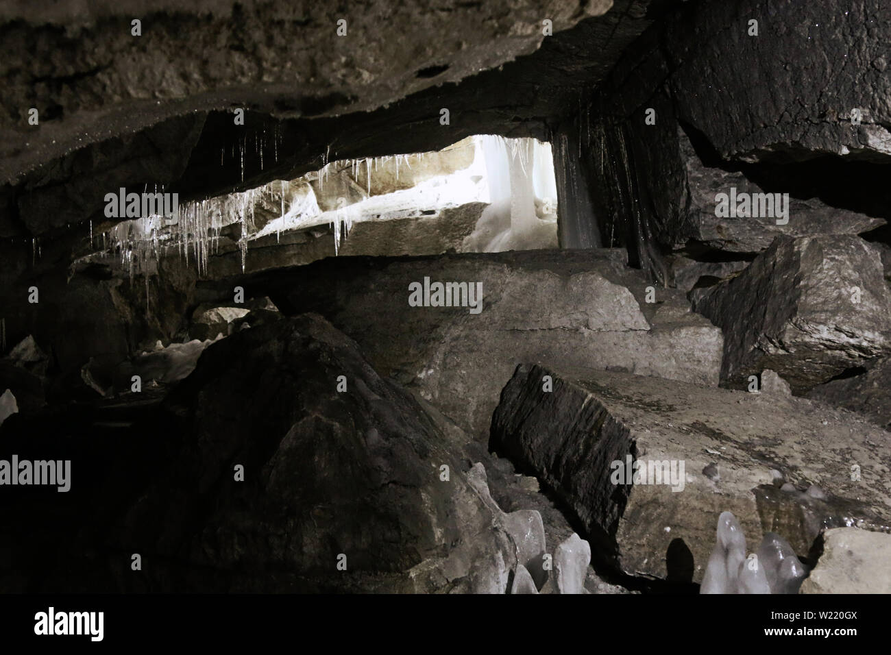 Ice stalactites, stalagmites and columns in cave, ice bodies, ice ...