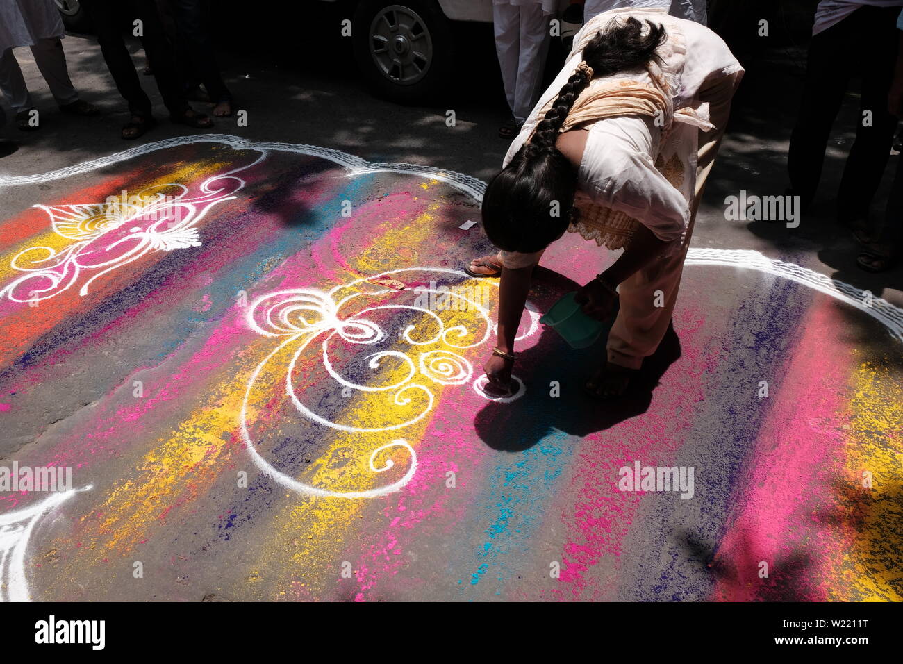 Road art(Alpona) is being given by a worker of ISKCON Kolkata (Photo by ...
