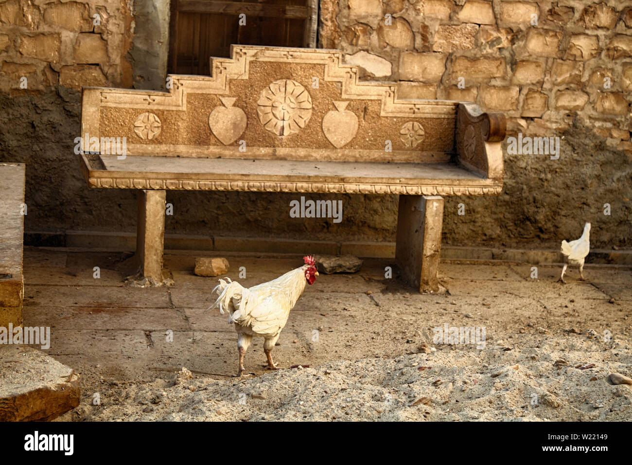 Elegant stone bench with carvings and chickens, stone carving Stock ...