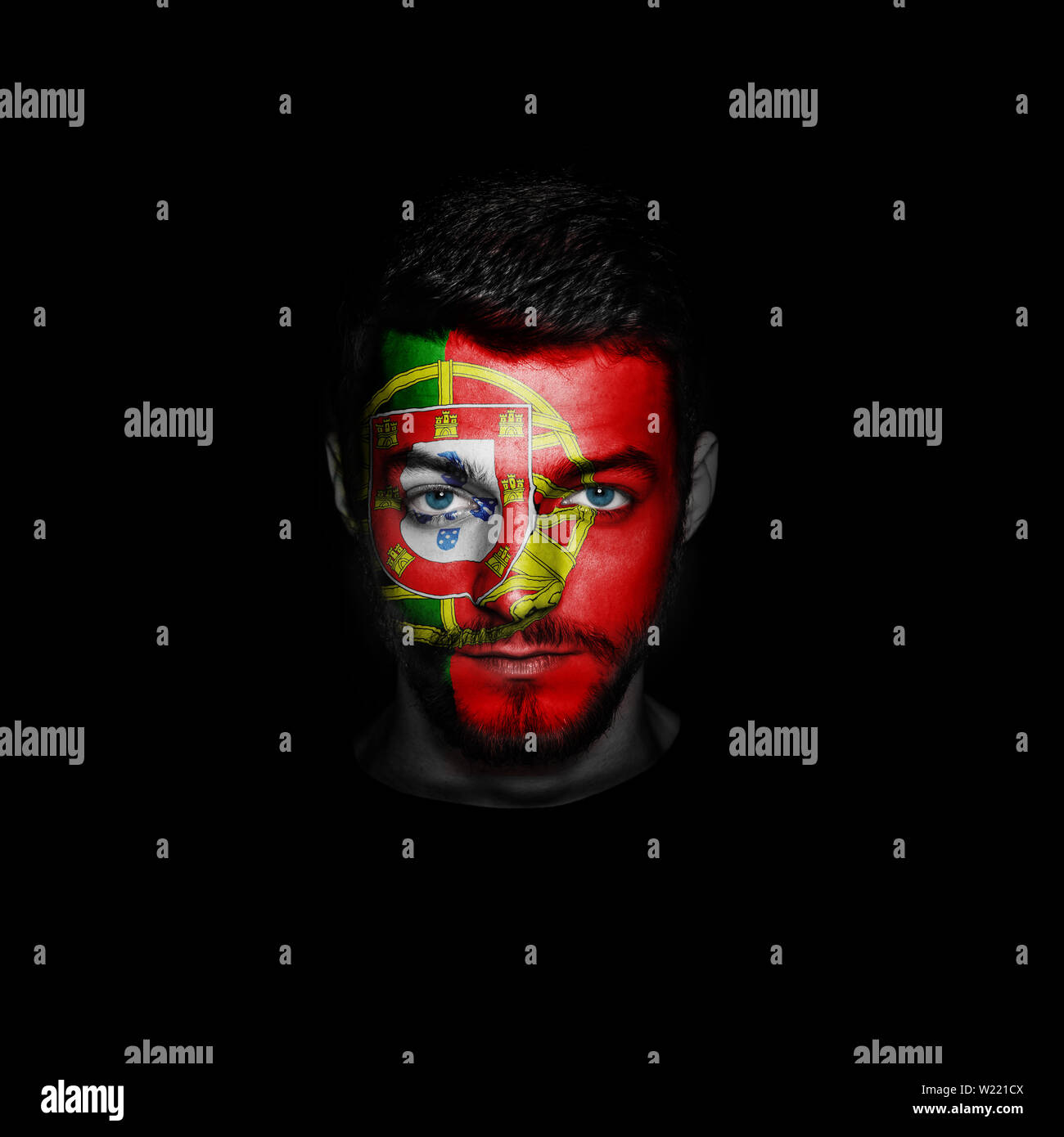 Flag of Portugal painted on a face of a man Stock Photo - Alamy