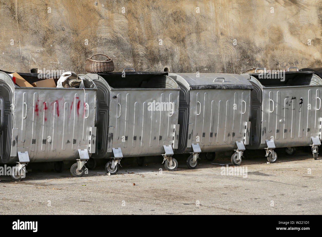 Containers for household garbage in the city Stock Photo - Alamy