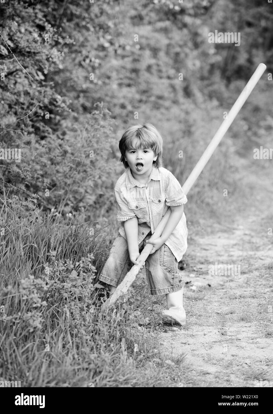 I want to find treasures. Little boy with shovel looking for treasures ...