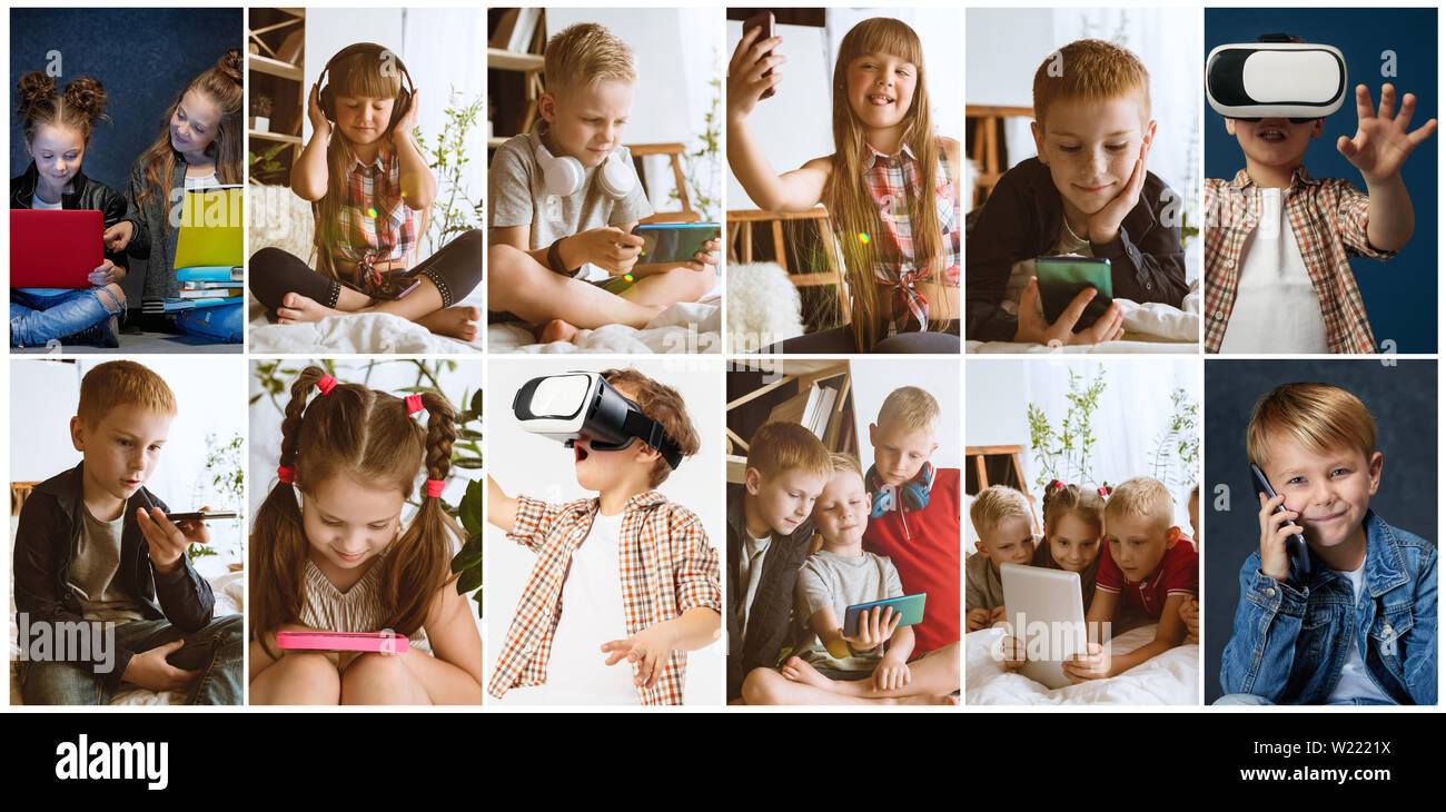 Portrait of kids using different gadgets on multicolor background. Male ...