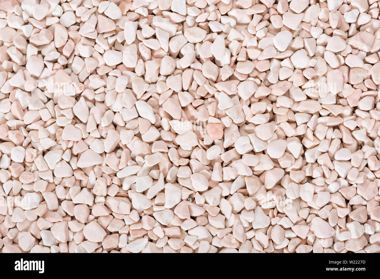 Small dry pale pebbles background. High quality texture in extremely ...