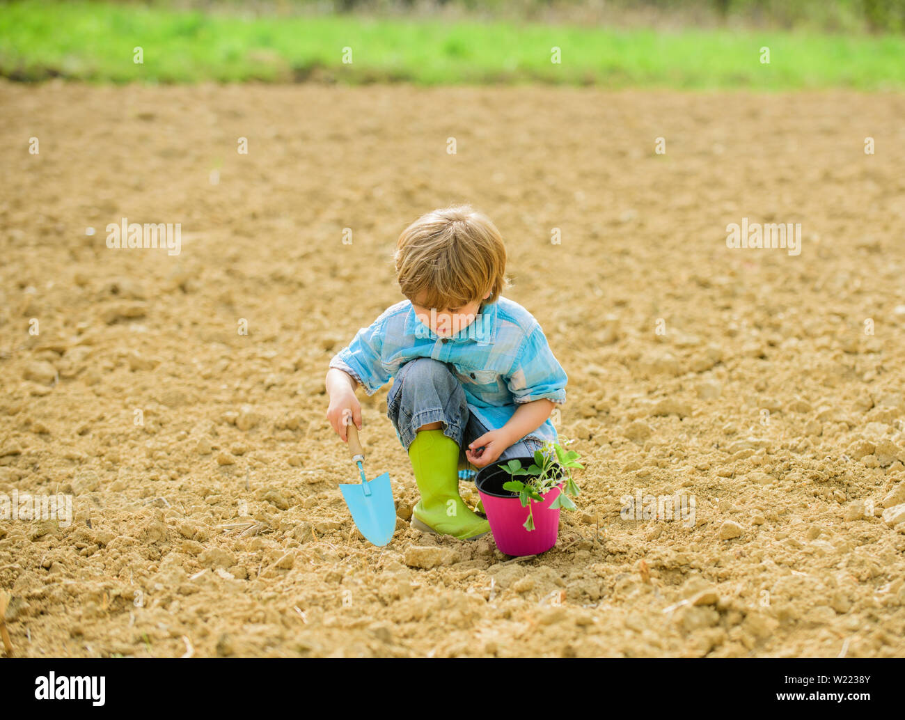 happy child gardener. spring country side village. earth day. soils and ...
