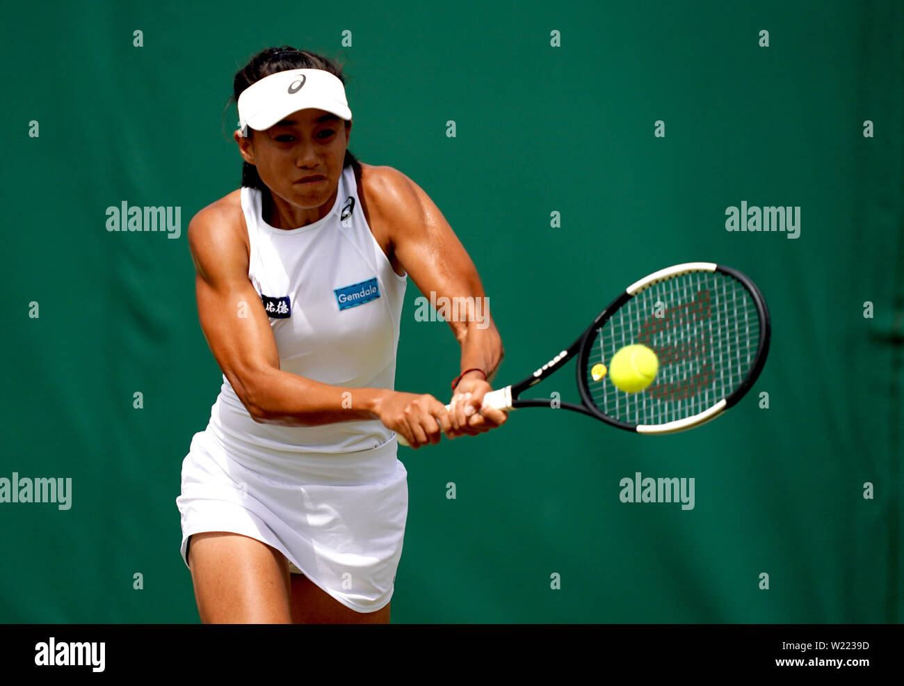 Shuai Zhang in action against Caroline Wozniacki on day five of the ...
