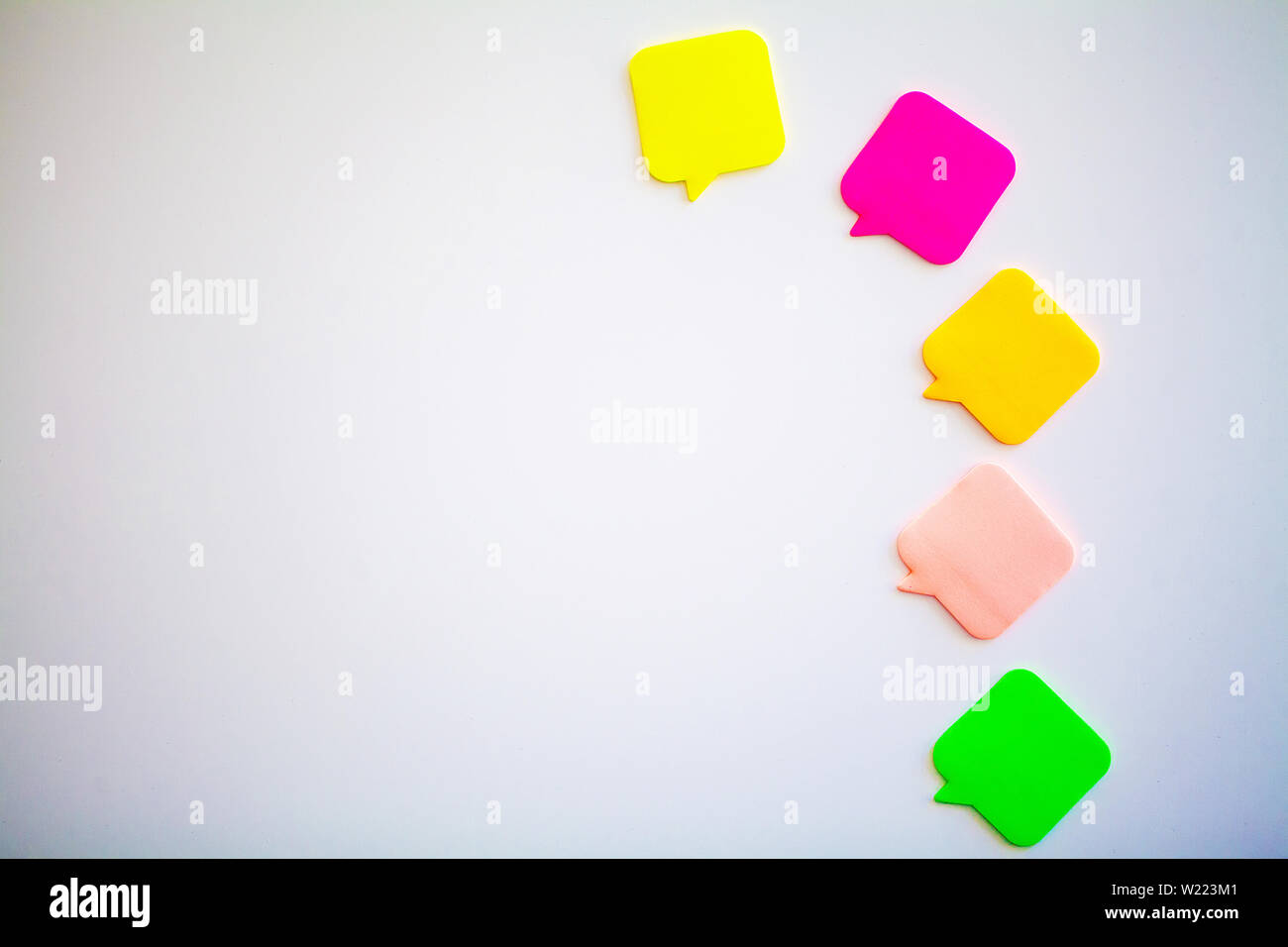 Colorful stickers on white wall. Empty Space for text Stock Photo - Alamy