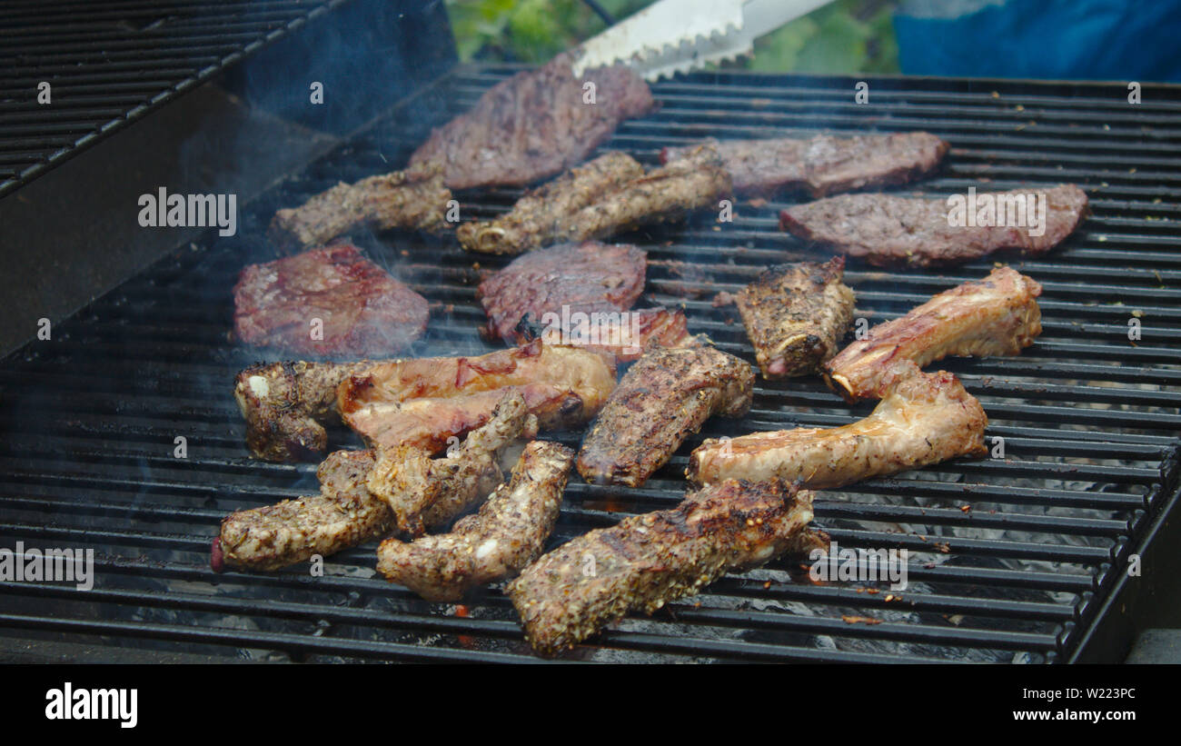 English garden during a barbecue Stock Photo - Alamy