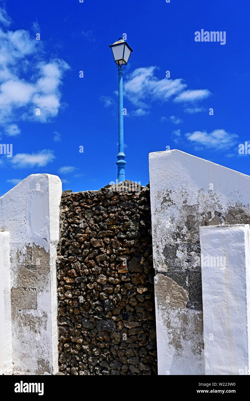 Lanzarote pyramid stairs lamp post with blue skies and palm trees Stock ...