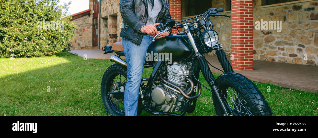Man riding custom motorbike Stock Photo - Alamy