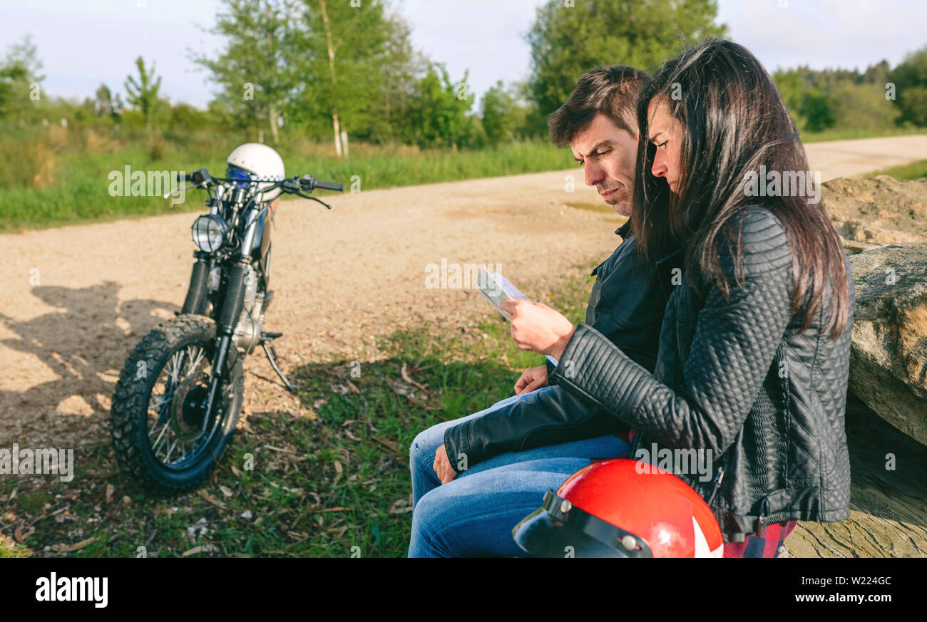 Biker looking at map hi-res stock photography and images - Alamy