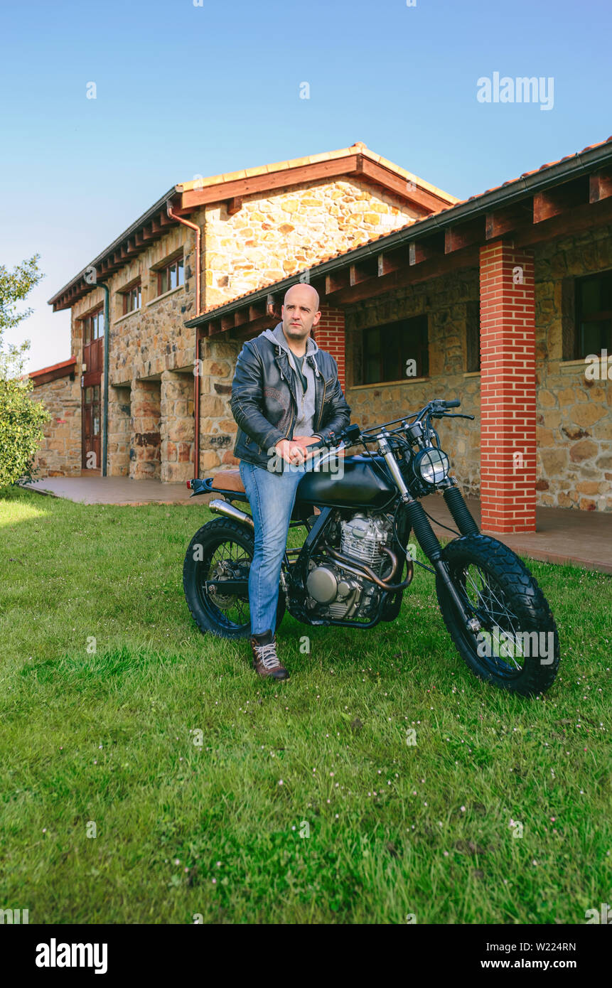 Man riding custom motorbike Stock Photo - Alamy