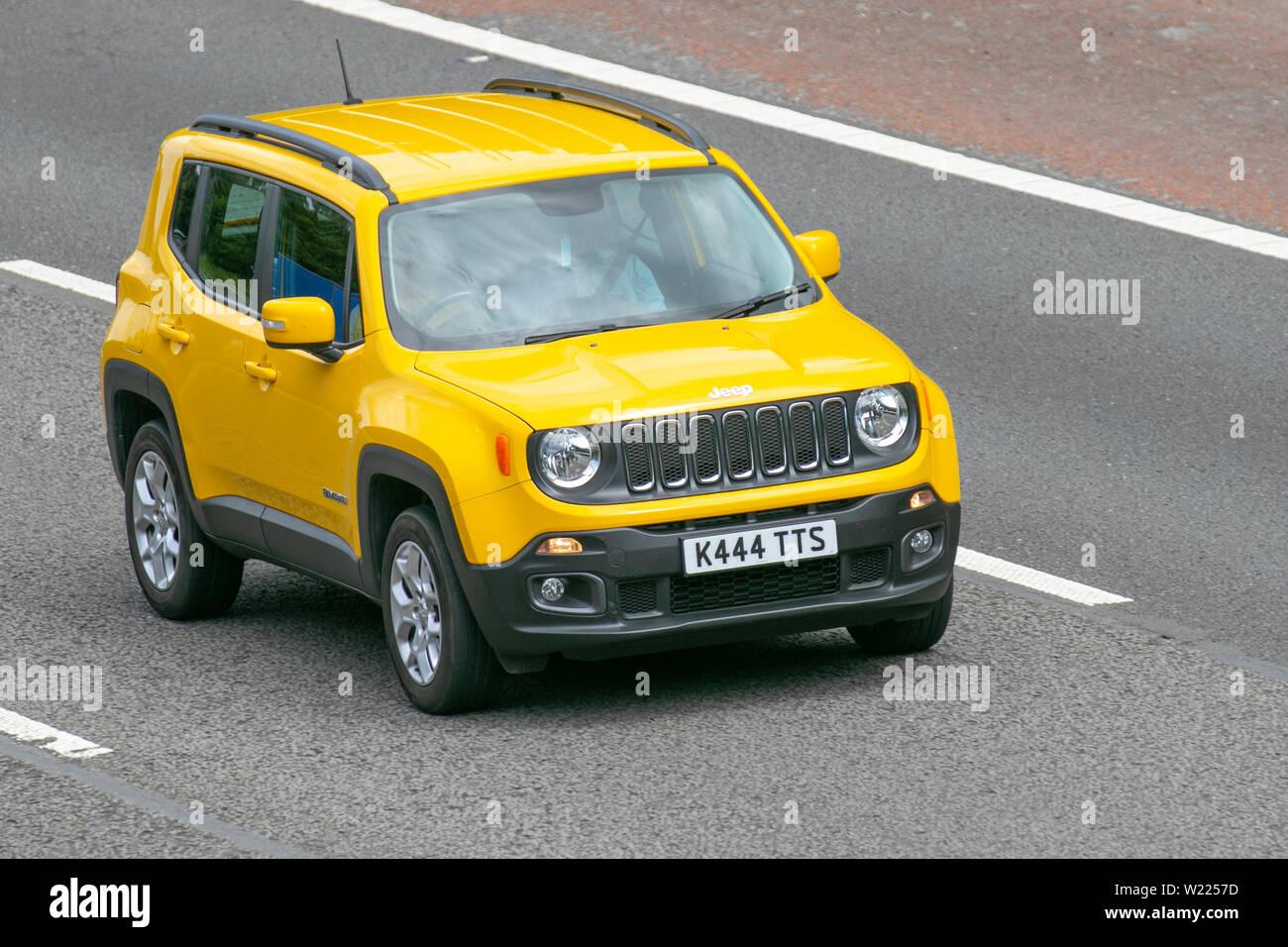 2016 yellow Jeep Renegade Longitude M-Jet; M6, Lancaster, UK; Vehicular ...