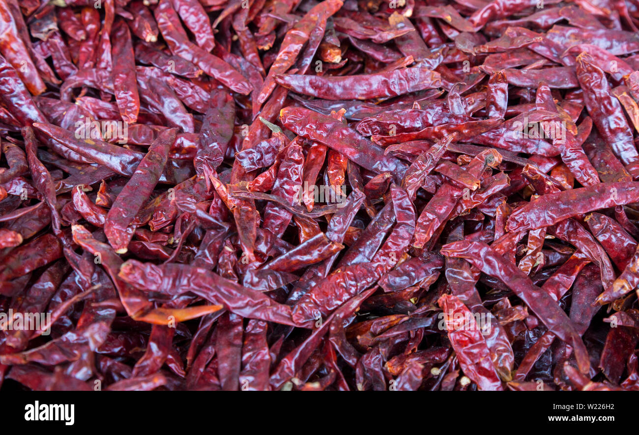 Dried red chili pepper, background Stock Photo - Alamy