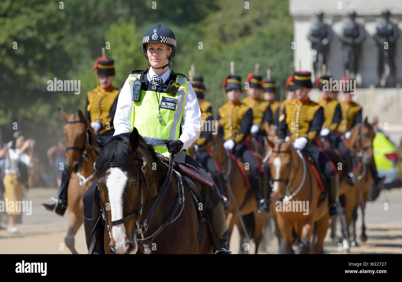 London, England, UK. Mounted police officer leading members of the King ...