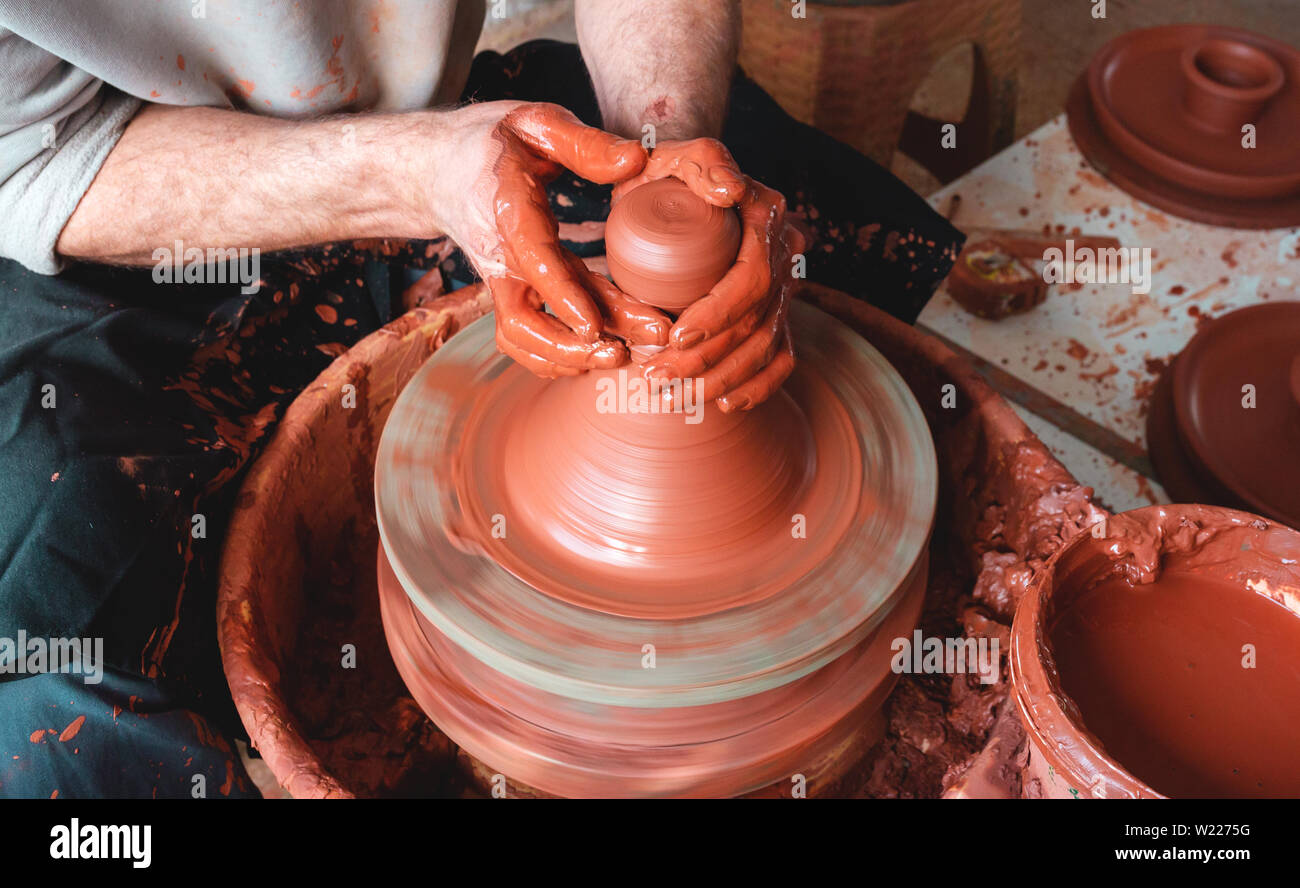 Professional potter making bowl in pottery workshop, studio Stock Photo ...
