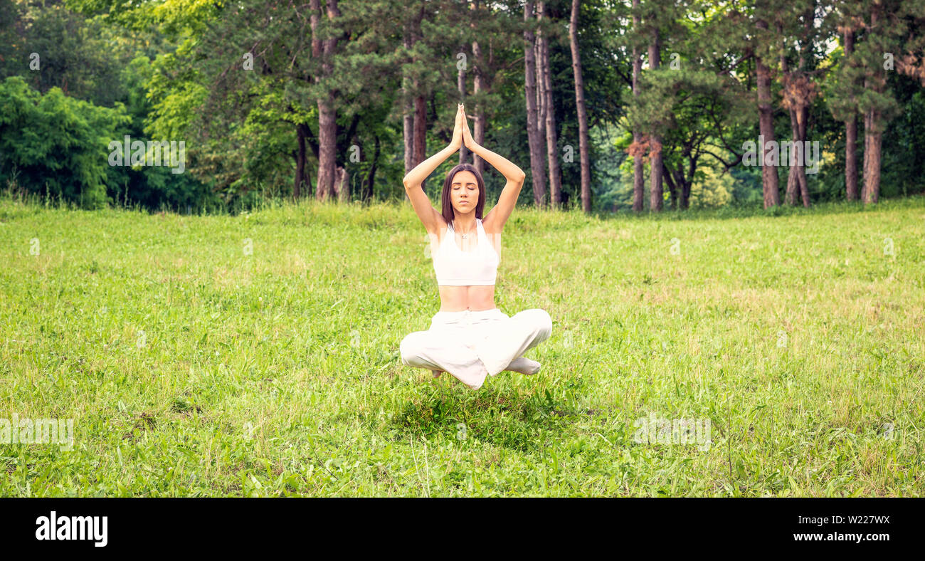 young girl levitating in yoga position, meditation outdoor Stock Photo ...