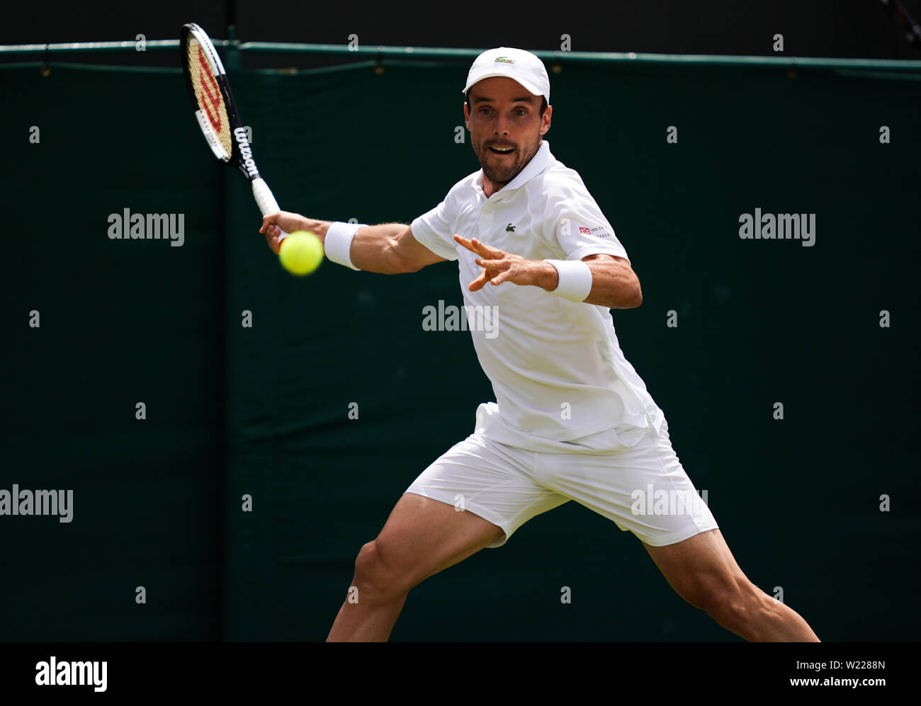 Roberto Bautista Agut in action against Karen Khachanov on day five of the Wimbledon ...