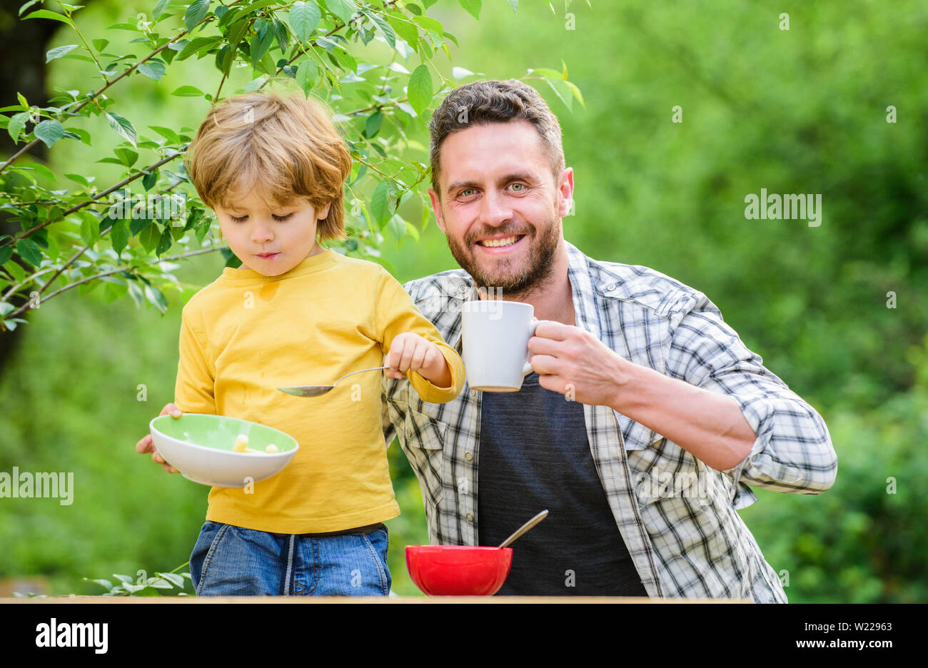 Little boy and dad eating. Nutrition kids and adults. Healthy nutrition ...