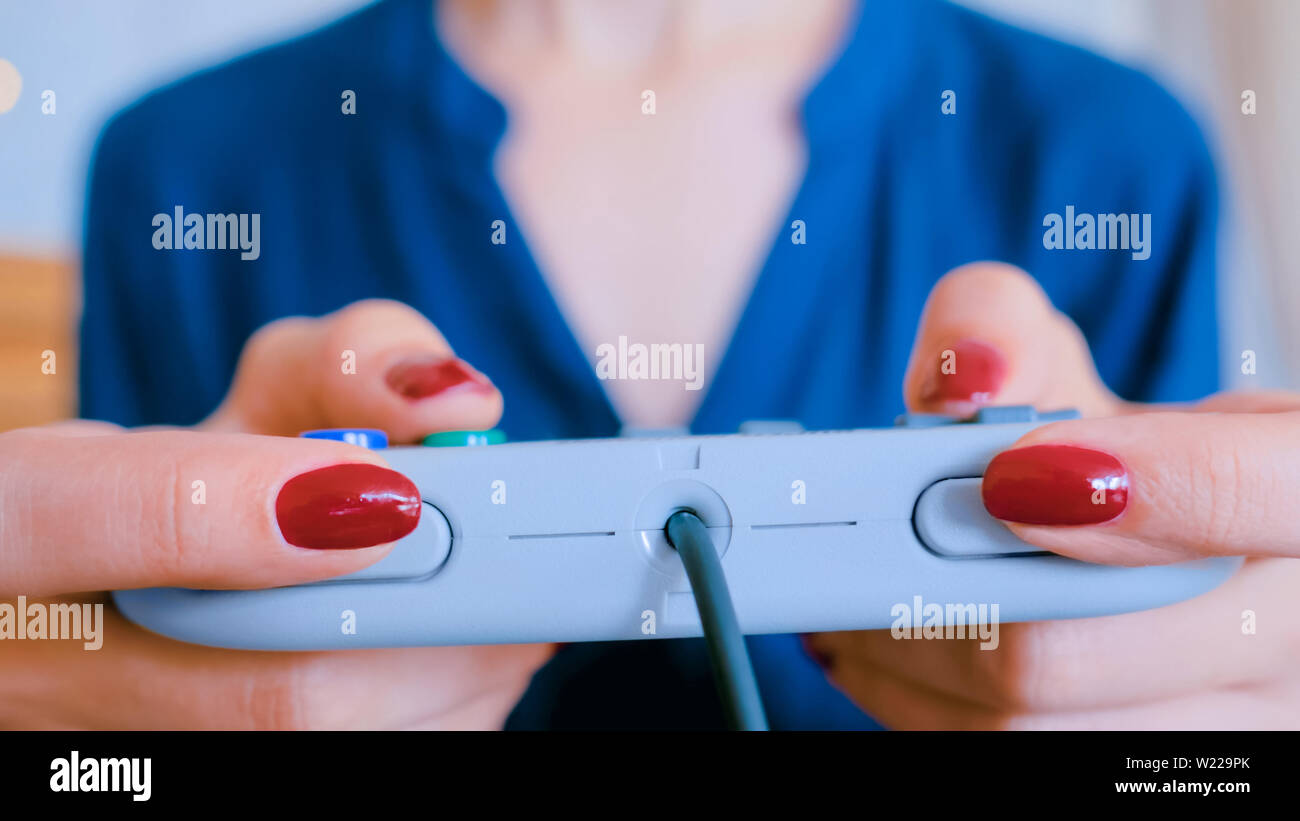Woman playing video games Stock Photo - Alamy