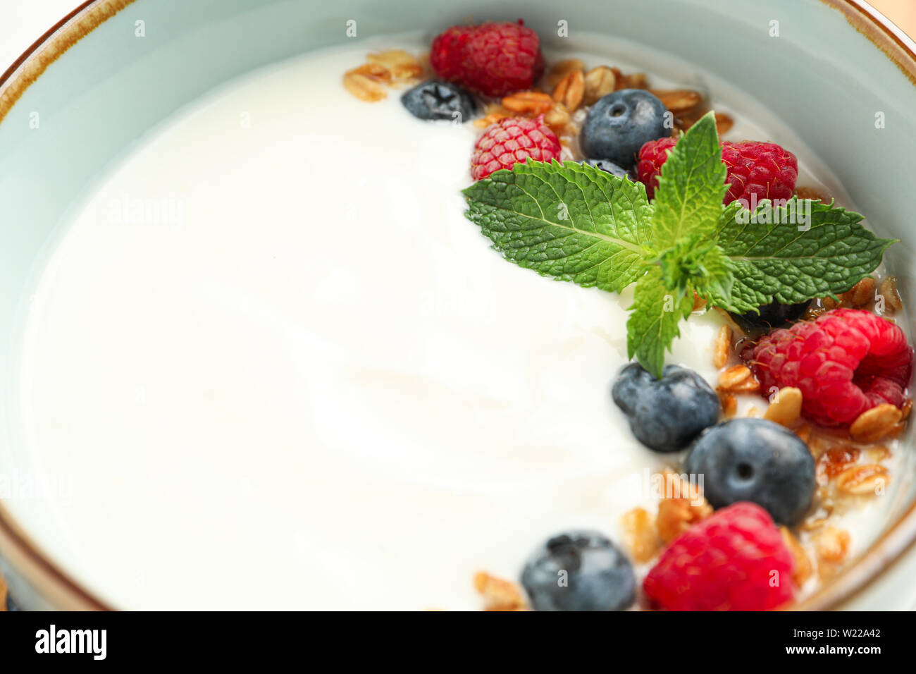 Composition with yogurt dessert and ingredients on white background ...