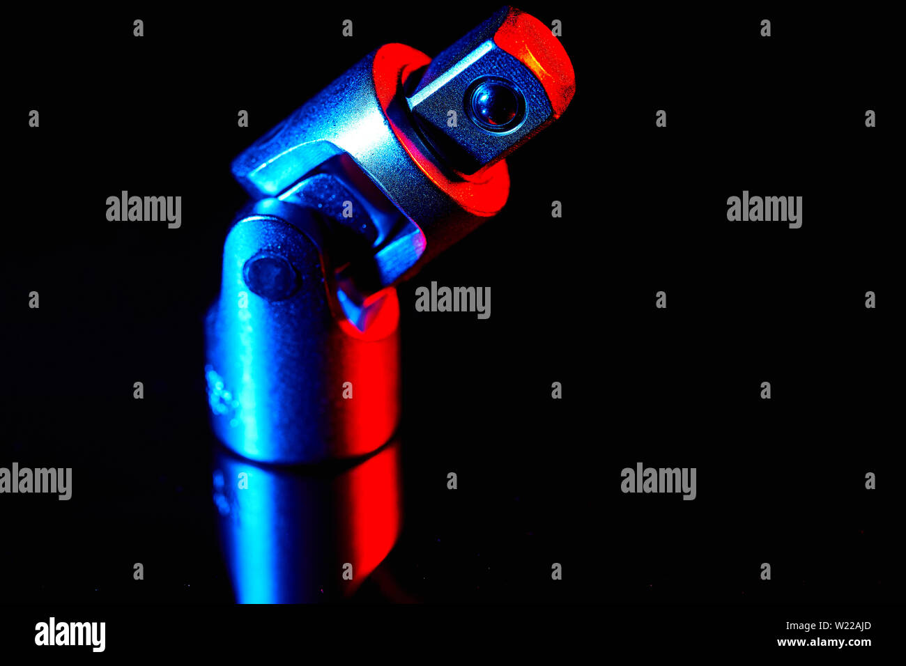 Swivel key head on black background with reflections. Mixed lighting ...