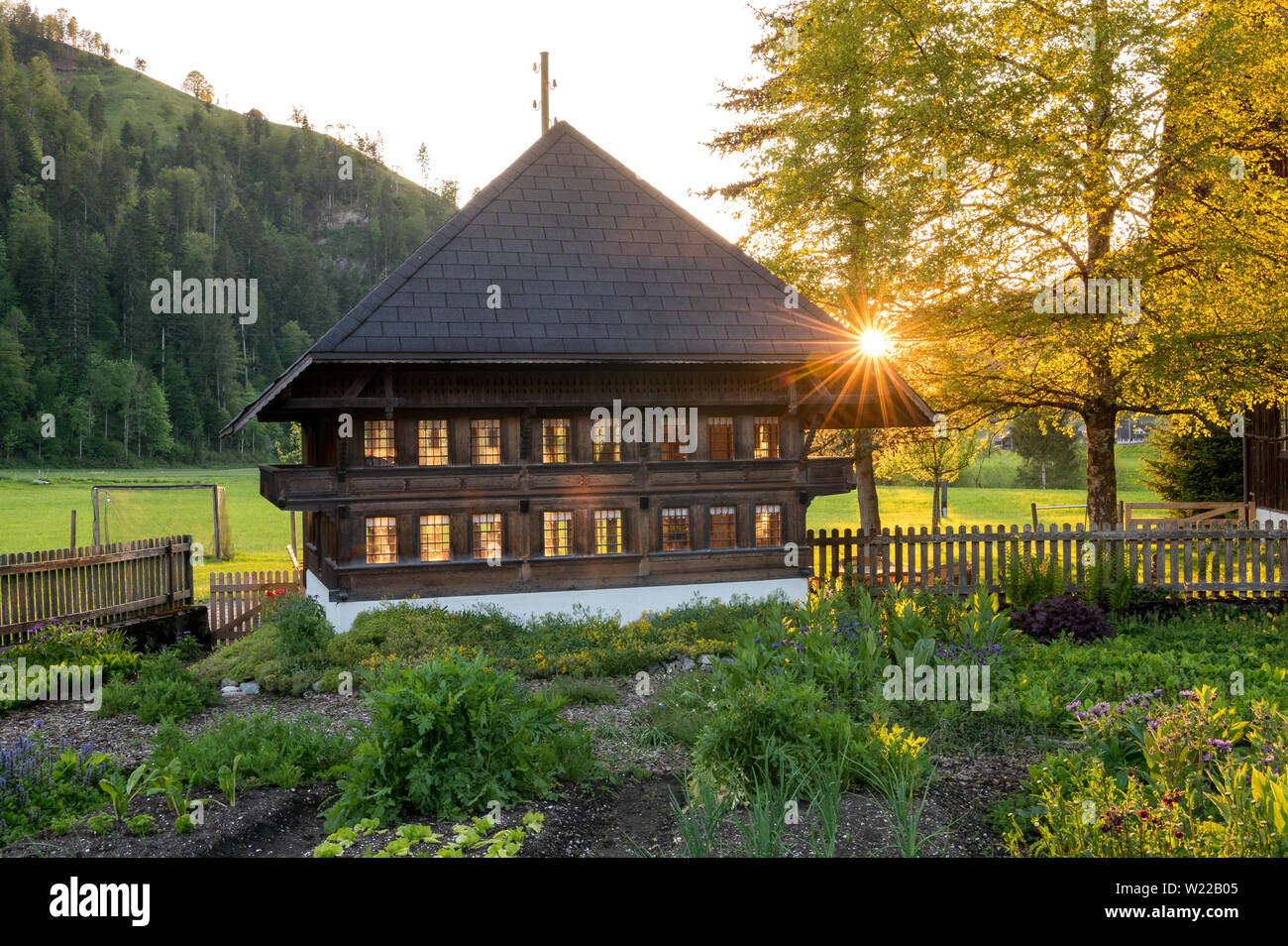sunset behind a typical farmhouse in Emmental Stock Photo - Alamy