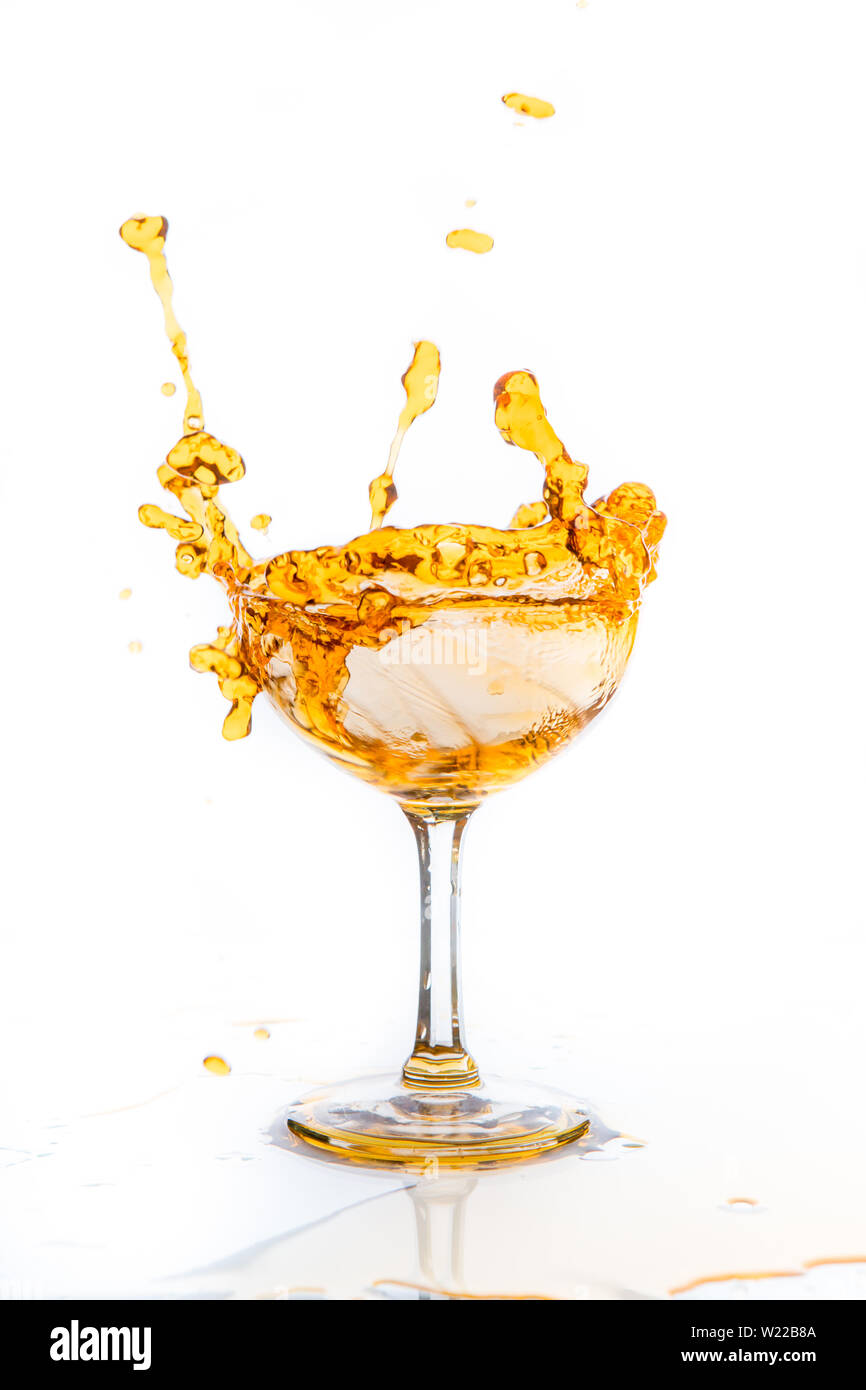 cocktail splash on white background Stock Photo - Alamy