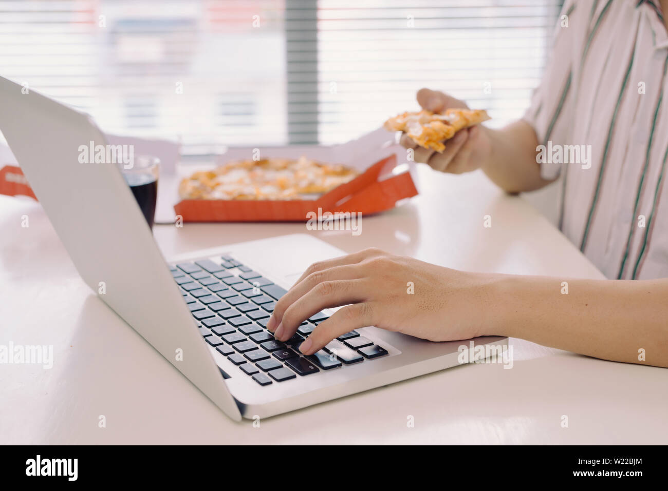 Happy man eating pizza night hi-res stock photography and images - Alamy