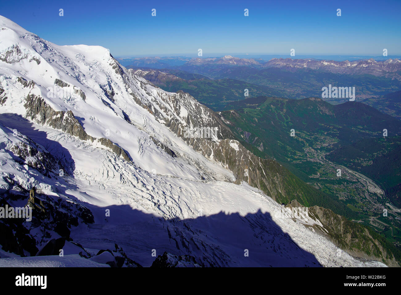 View from Aiguille Du Midi cable car station over Chamonix valley ...