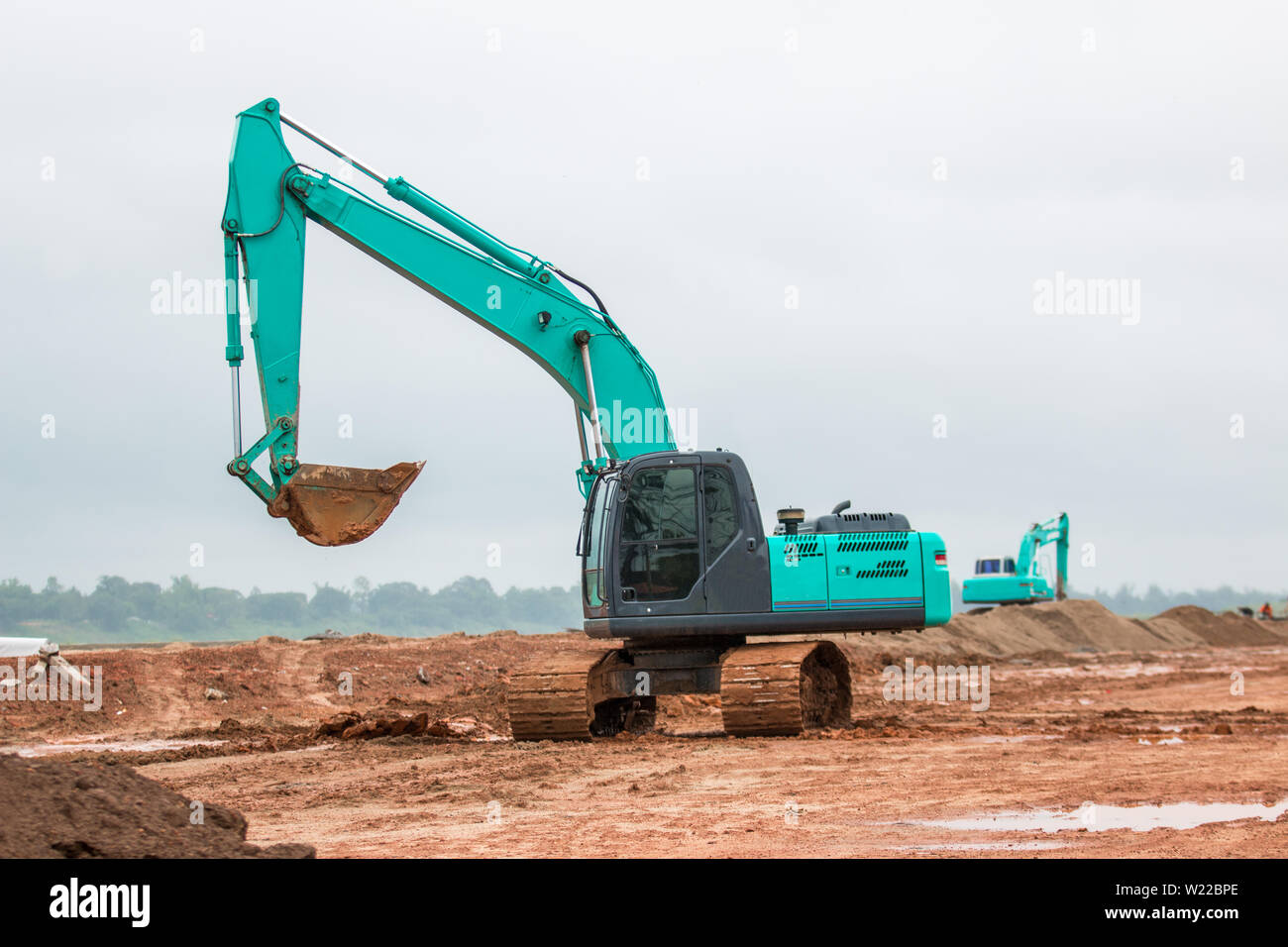 Excavator working in construction site Stock Photo - Alamy