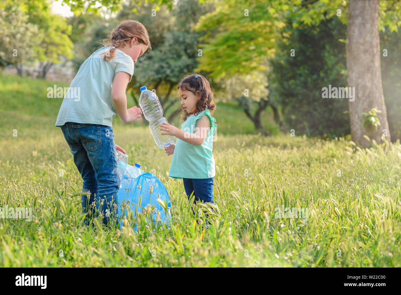 Children recycle bin diverse hi-res stock photography and images - Alamy