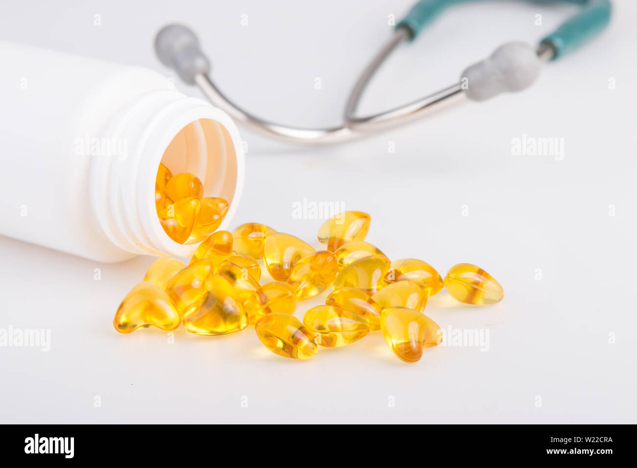 Capsules spilling out of container hi-res stock photography and images ...