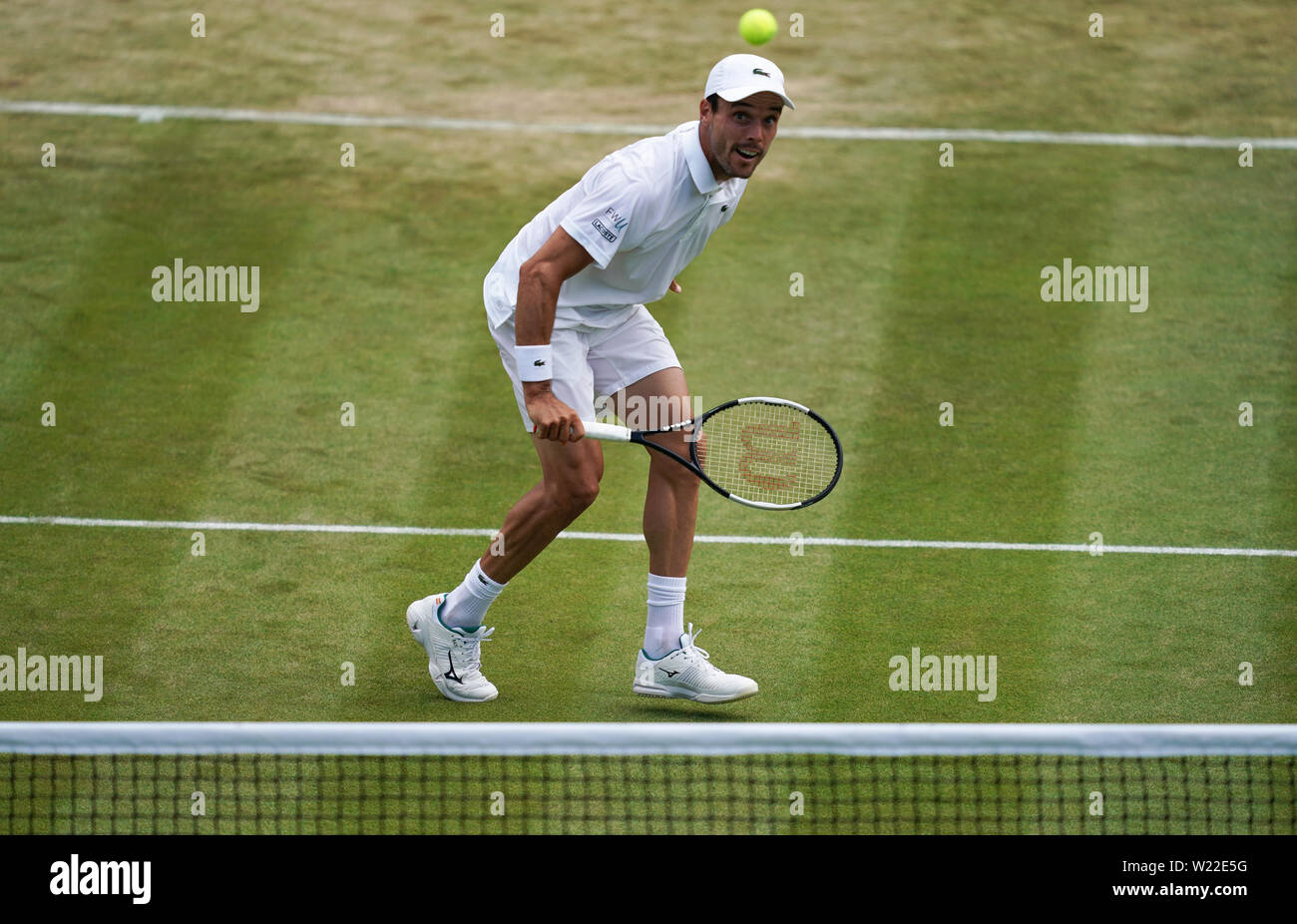 Roberto Bautista Agut in action against Karen Khachanov on day five of the Wimbledon ...