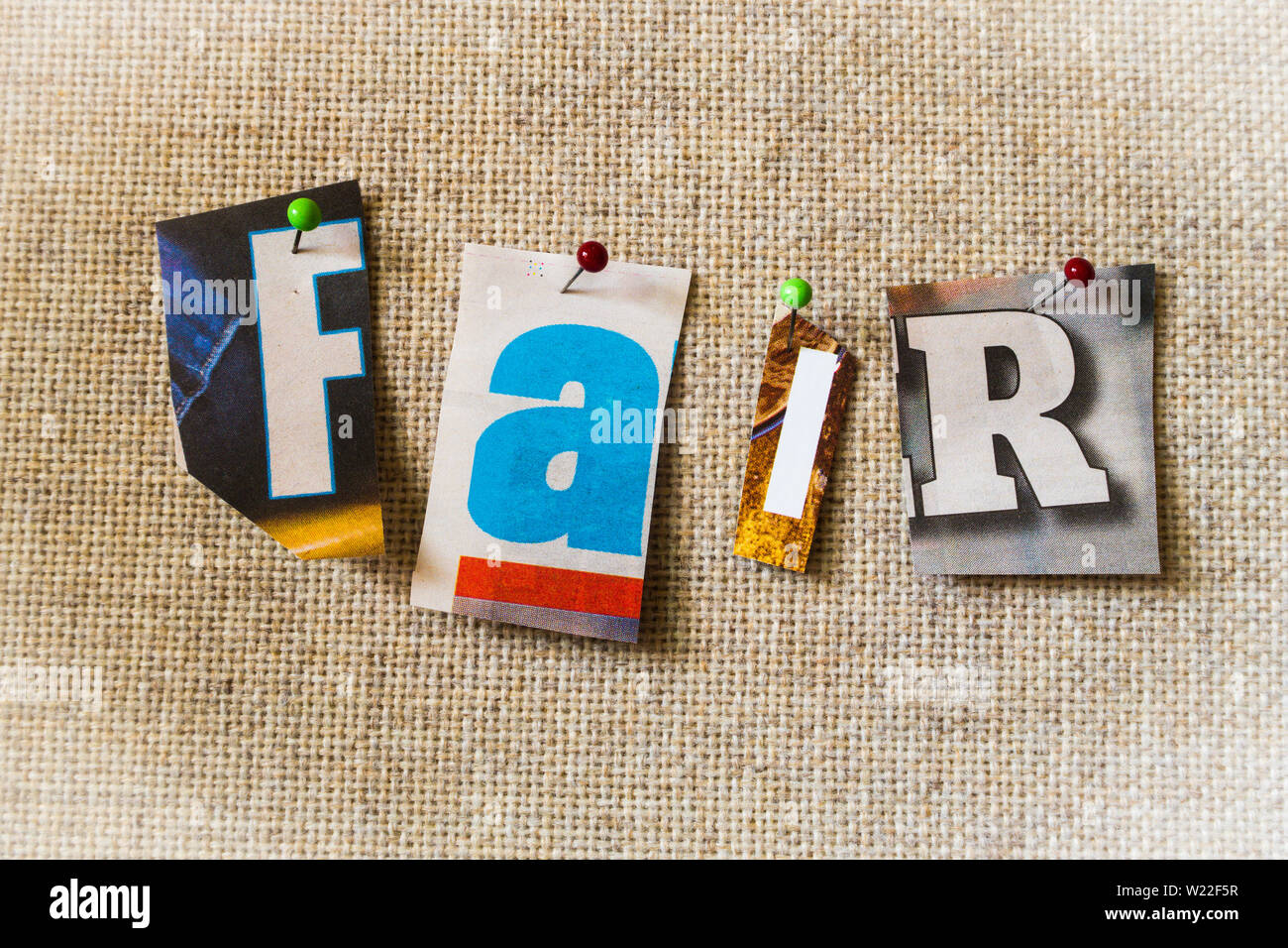 The word Fair on a bulletin board using cut-out paper letters in the ...