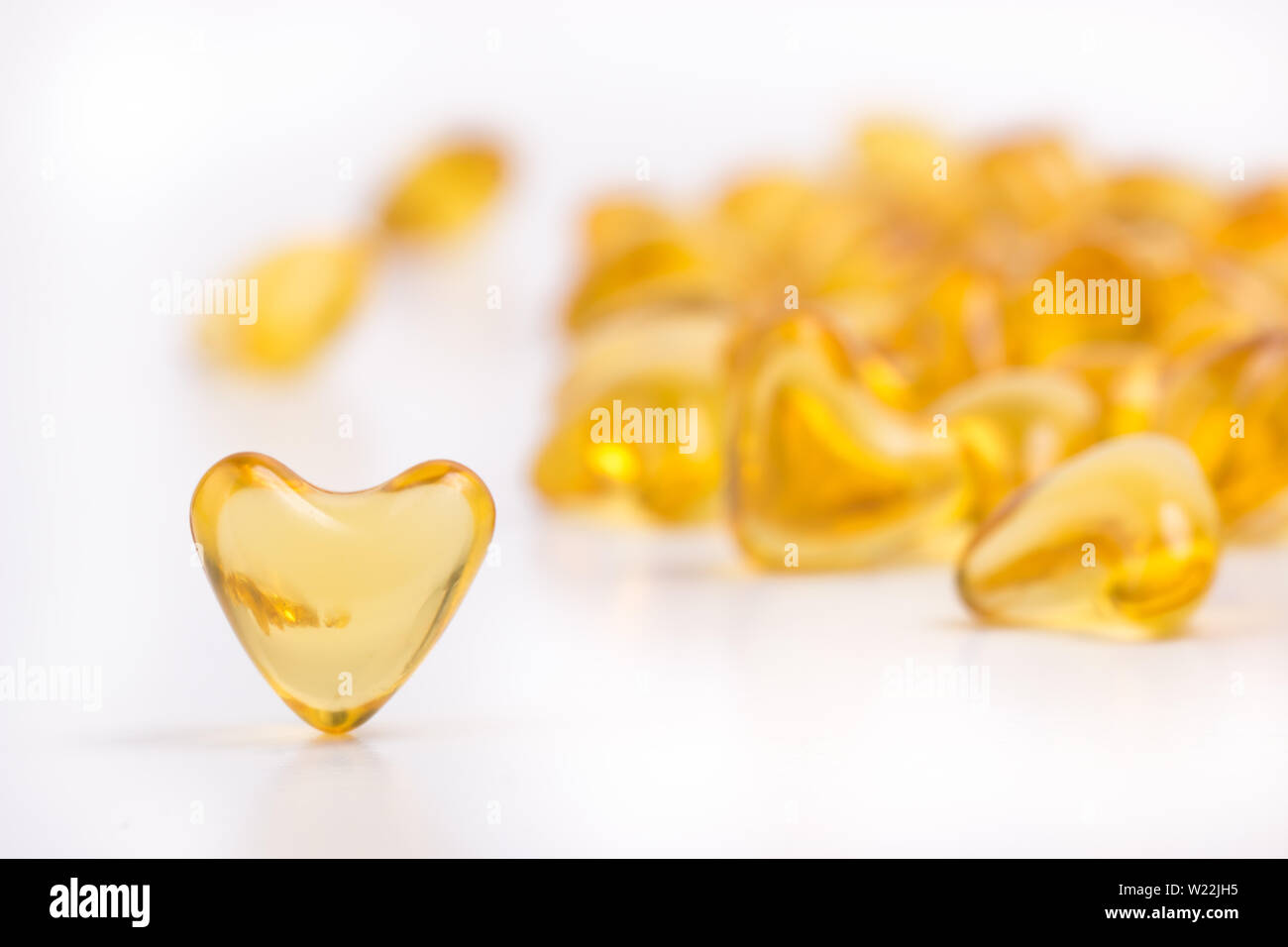 heart shape pill Stock Photo - Alamy