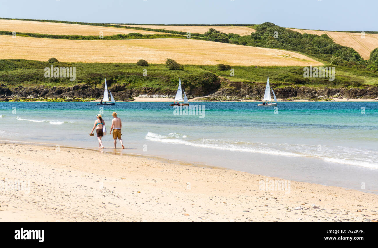 On the beach at Rock, North Cornwall, UK. People enjoying the beach and ...