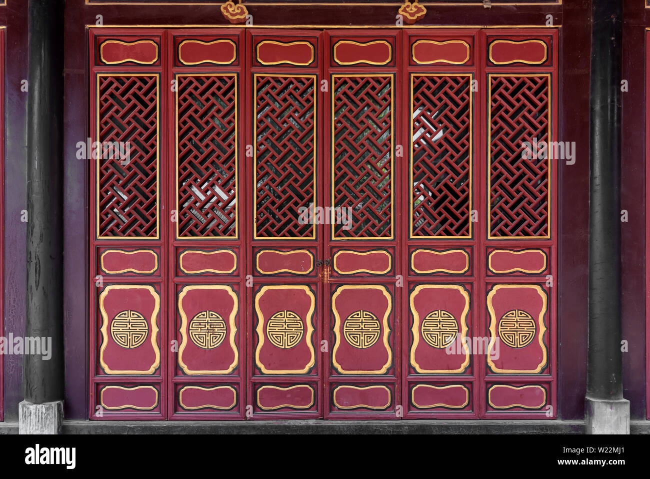 Chinese wooden red and golden door Stock Photo - Alamy