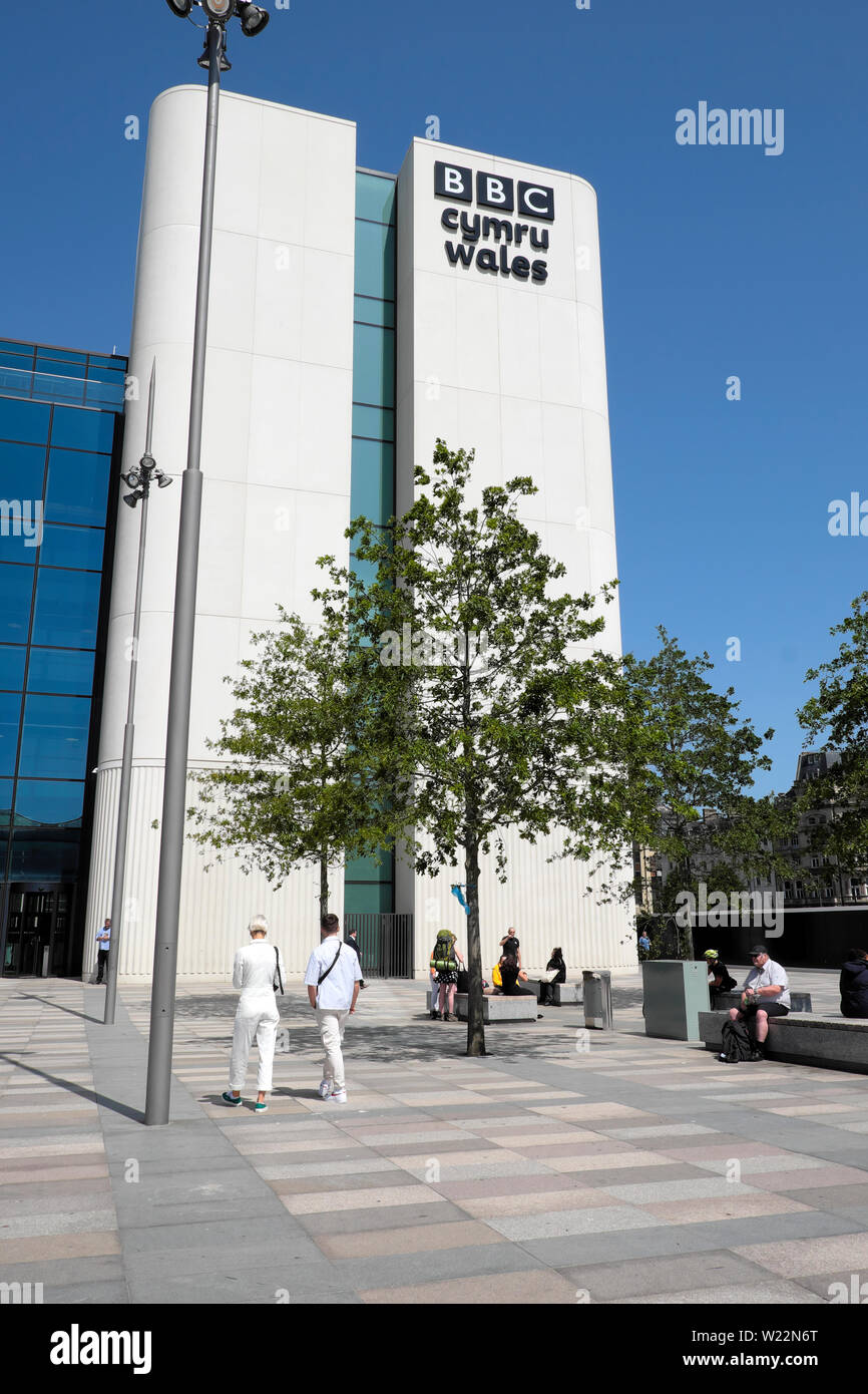 BBC Cymru Wales rear view two people wearing white clothing walking ...