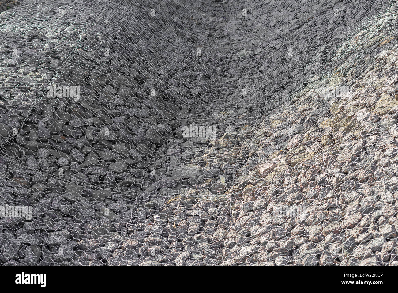 crushed stone mesh construction texture pattern Stock Photo - Alamy