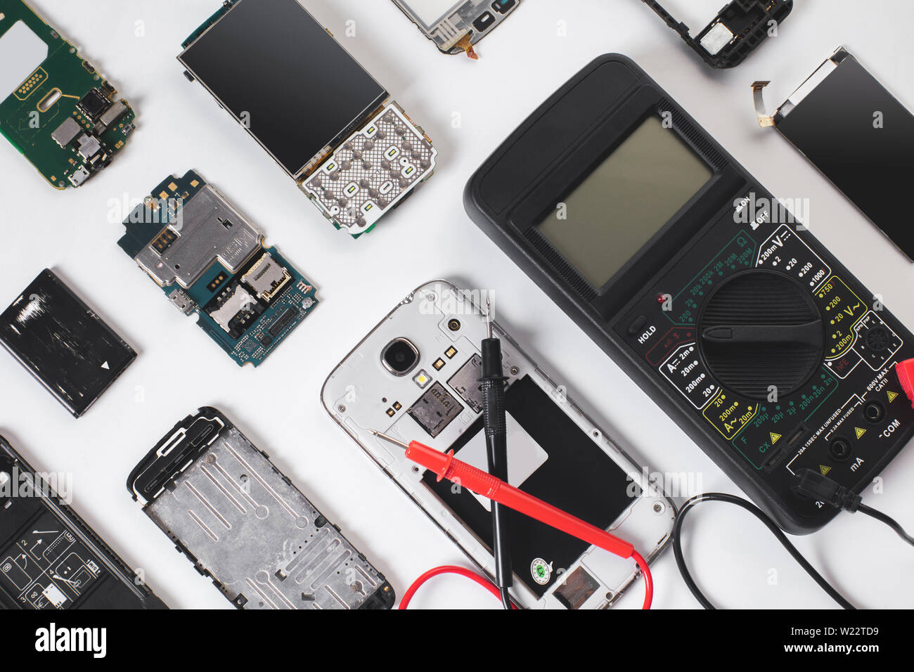 disassembled mobile phone and tools on white background Stock Photo - Alamy