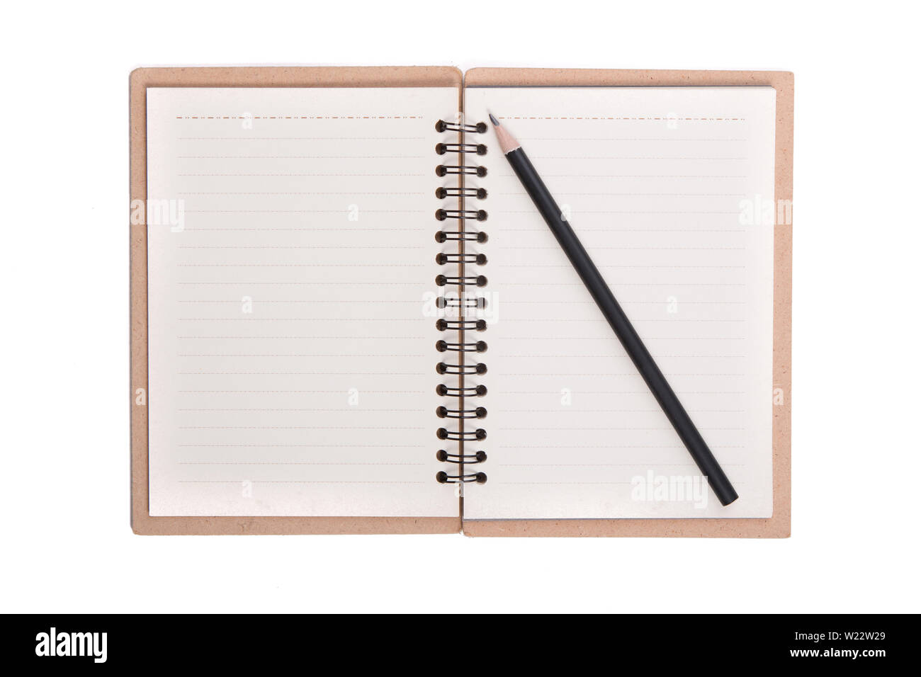 Closeup of book and pencil on white desk Stock Photo - Alamy