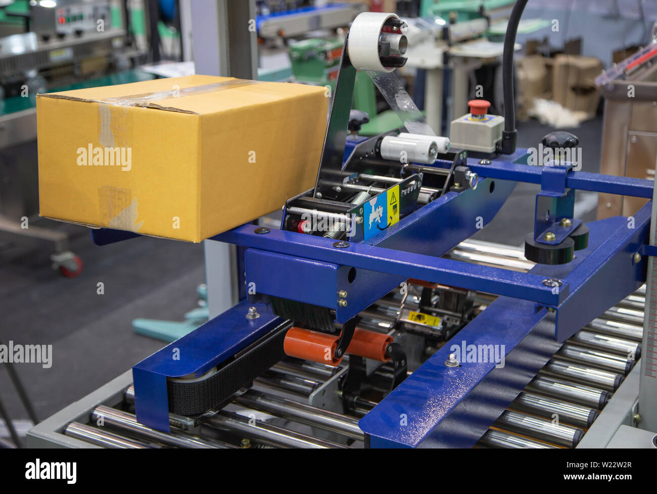 Semi automatic cardboard box tape sealing machine Stock Photo - Alamy