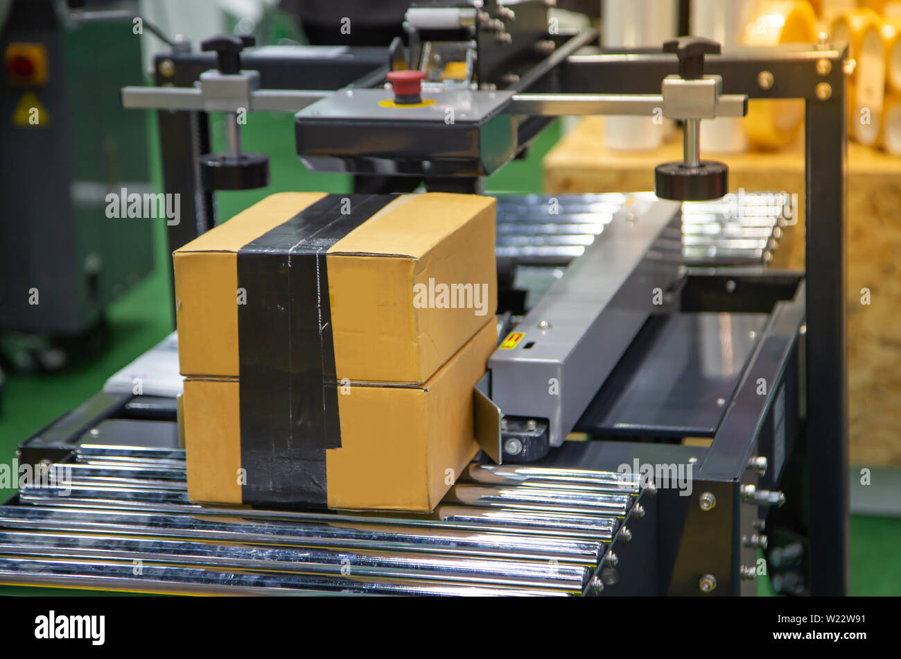 Semi automatic cardboard box tape sealing machine Stock Photo - Alamy