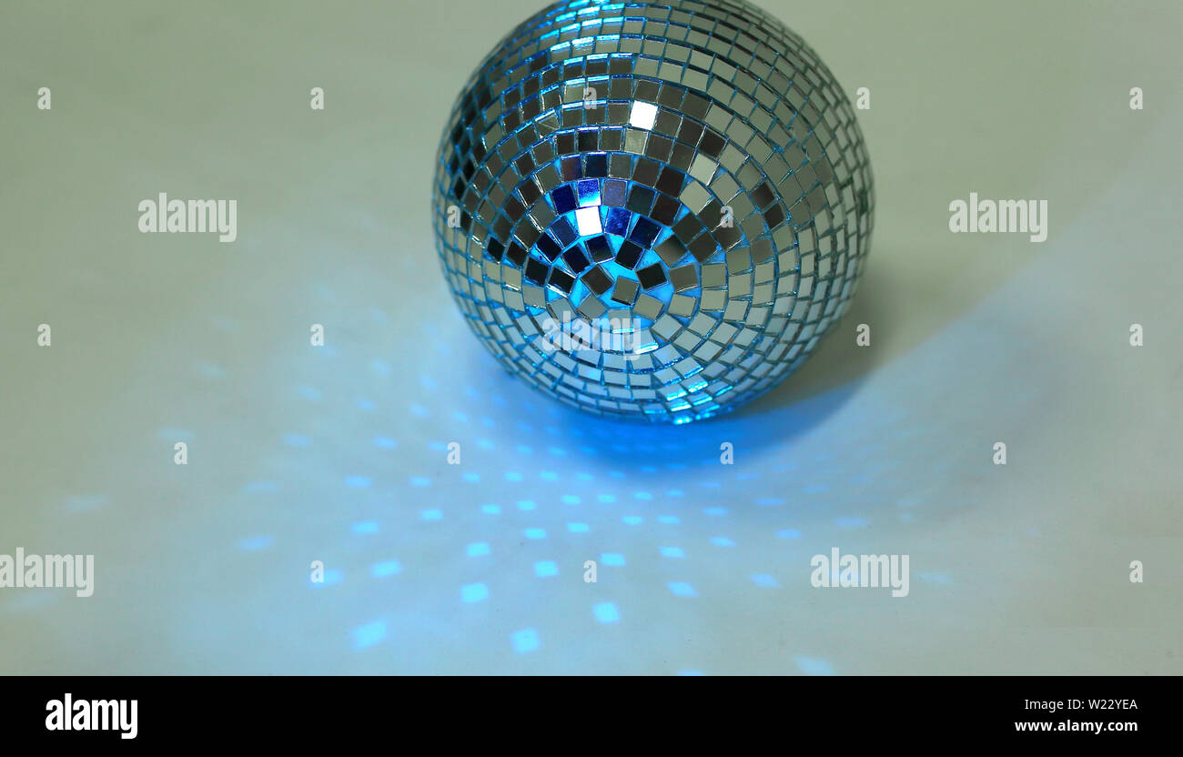 beautiful disco ball on yellow background isolated.photo with copy ...