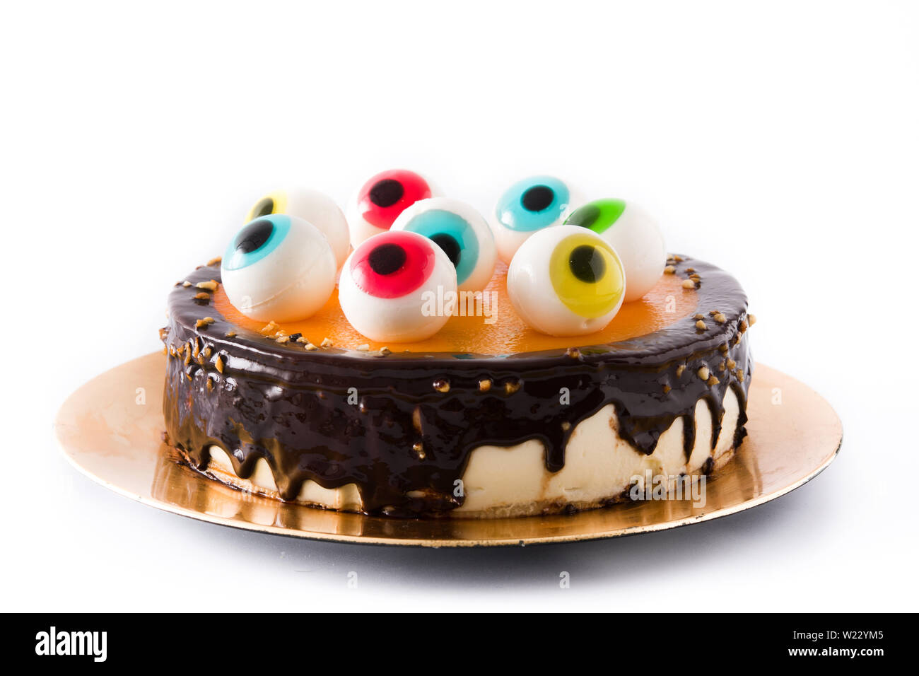 Halloween cake with candy eyes decoration isolated on white background ...