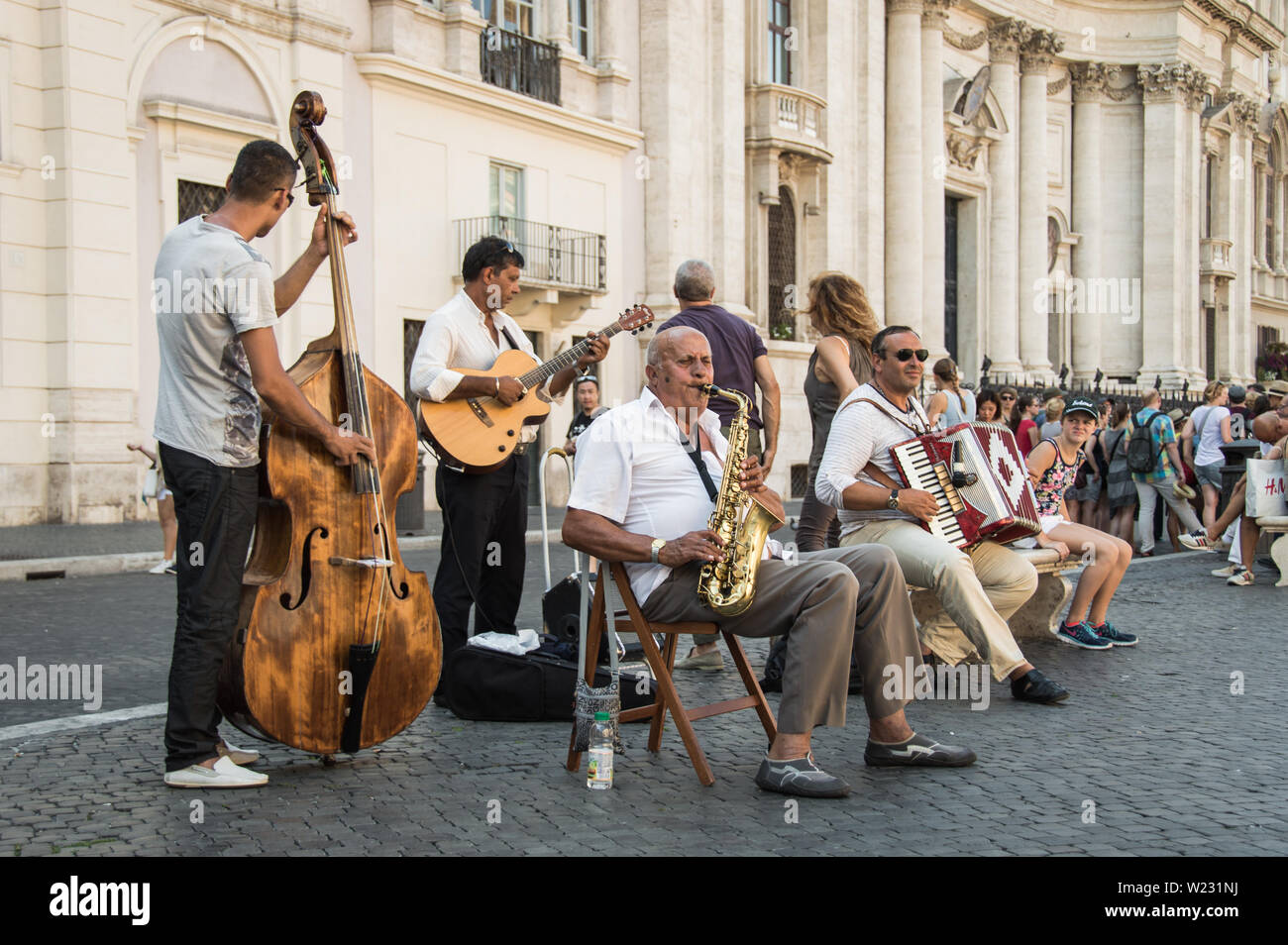 Rome - July 18th 2014: A group of street musicians playing traditional ...