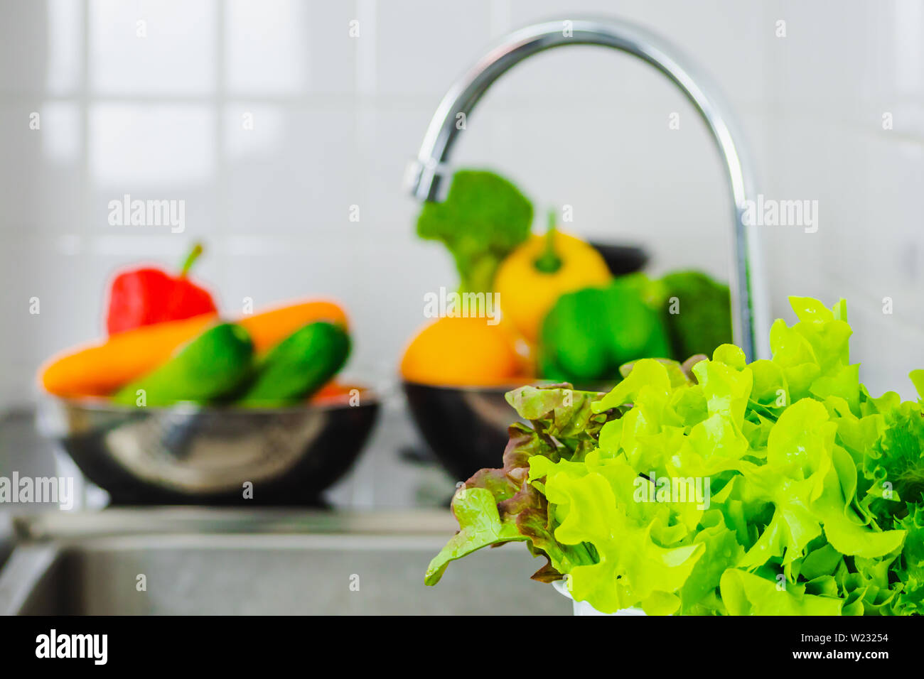 Preparing vegetable to washing to remove pesticides from skin Stock ...