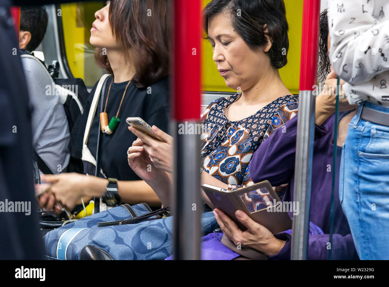 Mobile phones on the train hi-res stock photography and images - Alamy